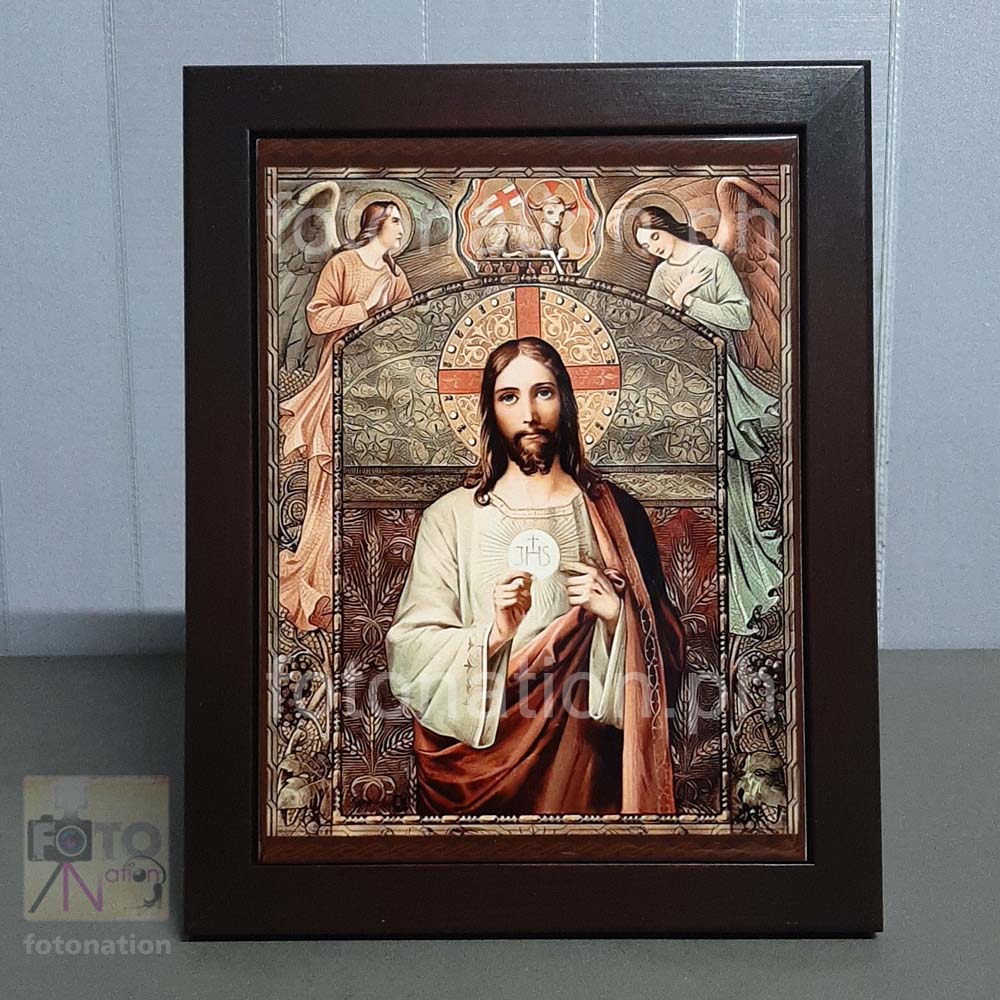 Wooden frame with religious image/Jesus holding the Eucharist printed ...