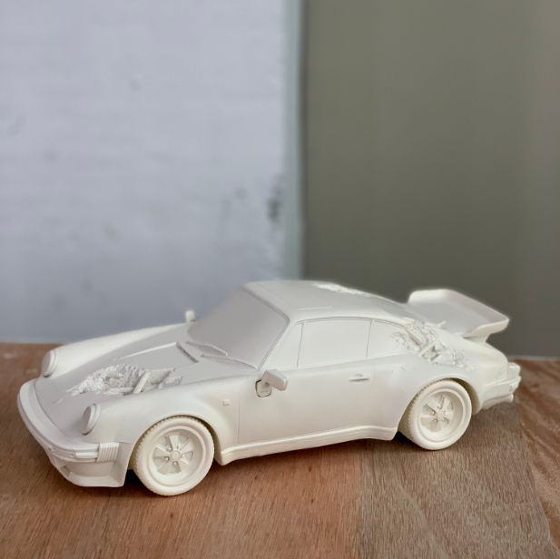 Dreamy The eroded car model sculpture is playing with tabletop ...